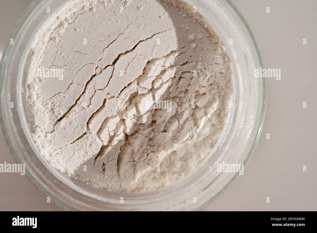 An open jar of face scrub-powder showing off its texture Stock Photo ...