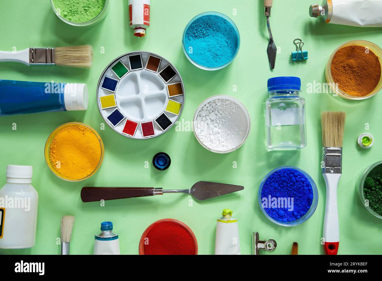 Painting equipment on green background - top view Stock Photo - Alamy