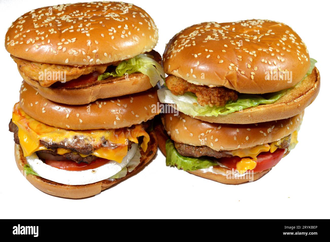 Pile of sesame buns of fried breaded chicken fillet patties, crisp ...