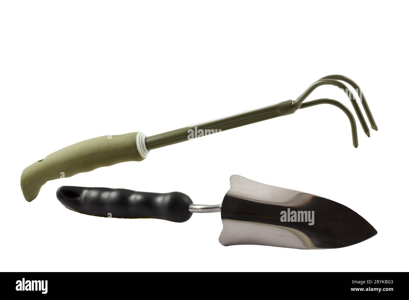 Small hand garden rake and a trowel on the white isolated background ...