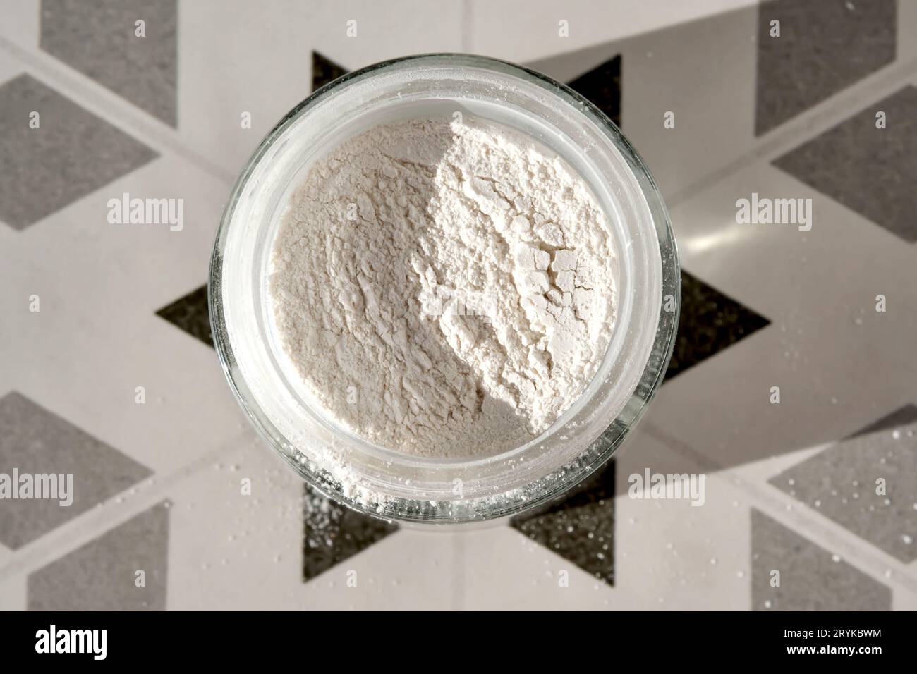 An open jar of face scrub-powder showing off its texture Stock Photo ...