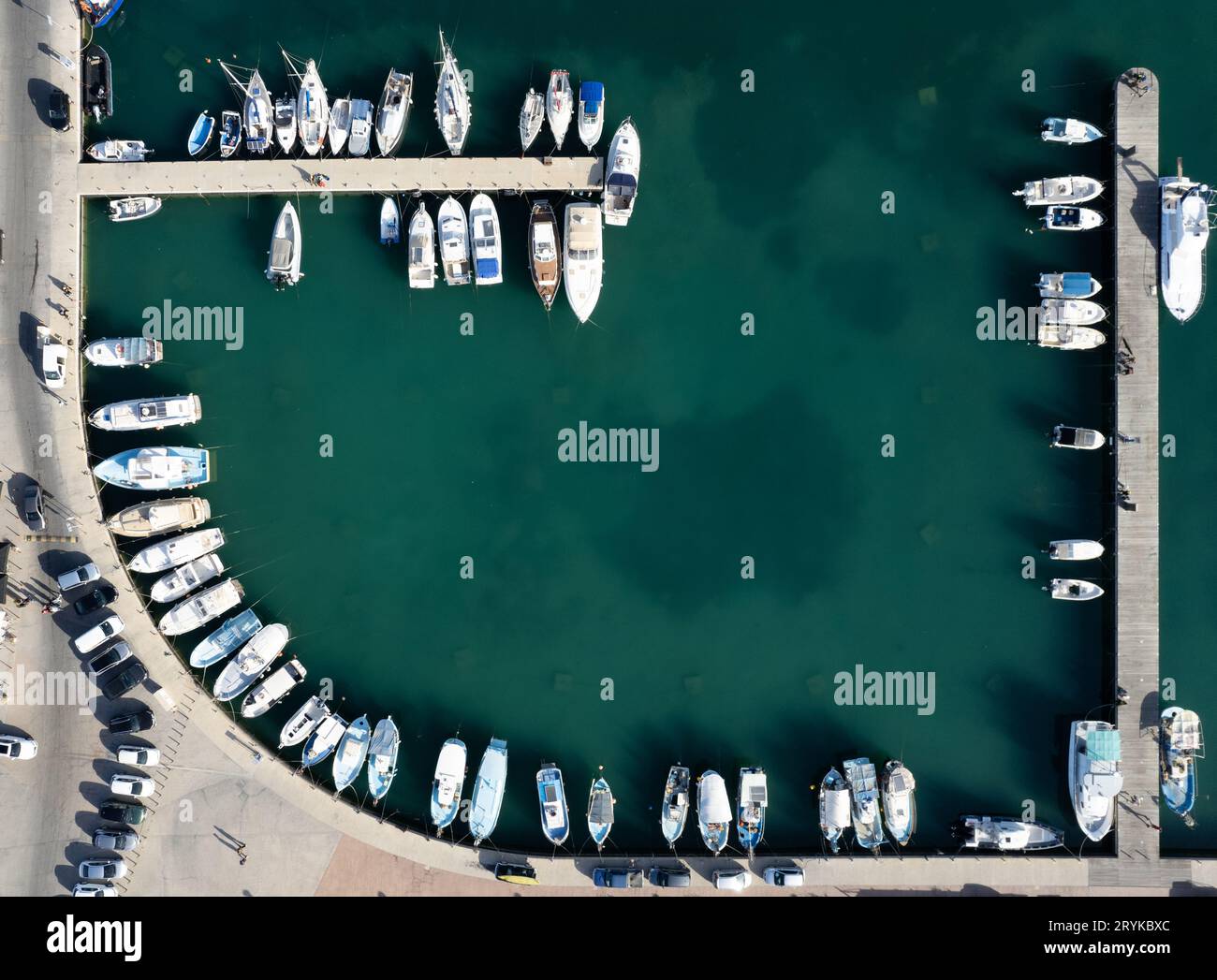 Drone aerial scenery of a fishing port. Fishing boats and yachts moored ...