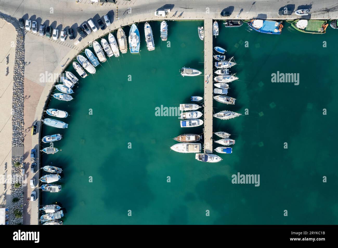 Drone aerial scenery of a fishing port. Fishing boats and yachts moored ...