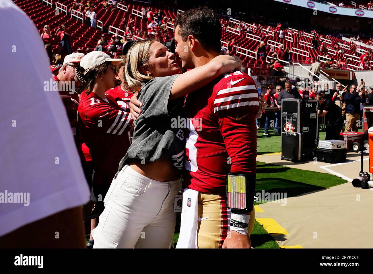 San Francisco 49ers quarterback Brock Purdy, right, hugs Jenna Brandt ...