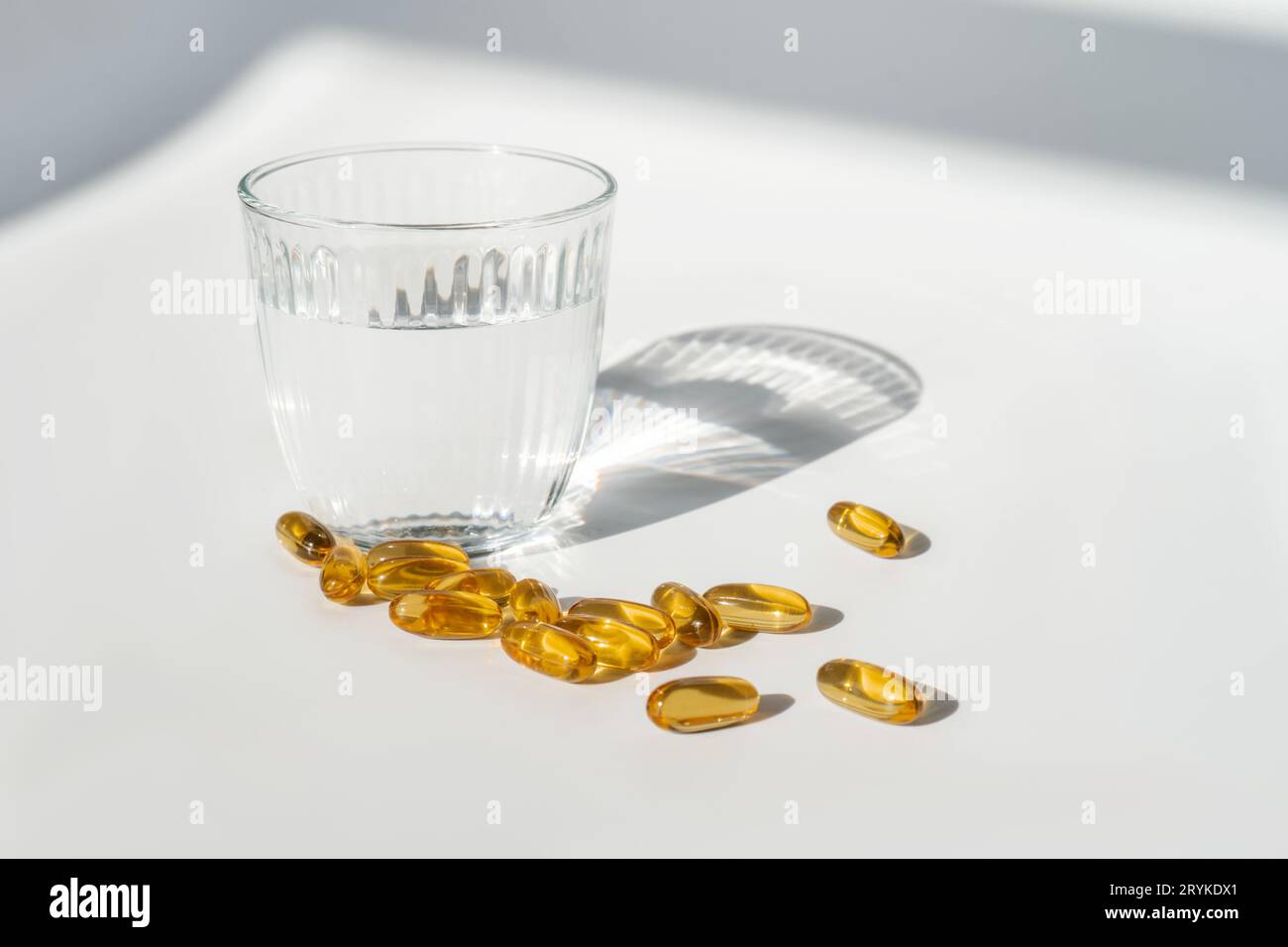 Oil filled capsules on the white background Stock Photo - Alamy
