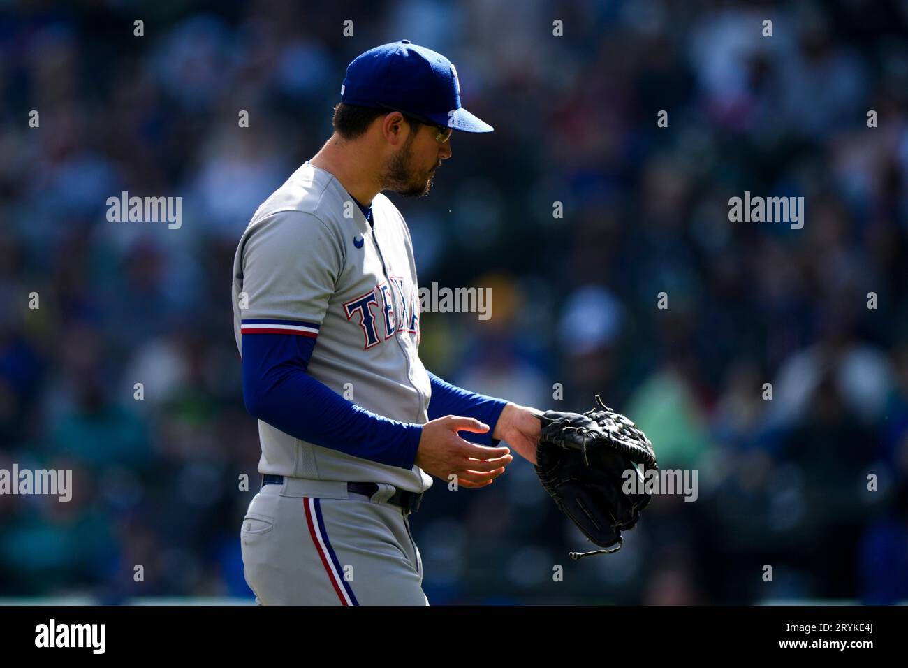 Texas Rangers starting pitcher Dane Dunning walks off the field after ...
