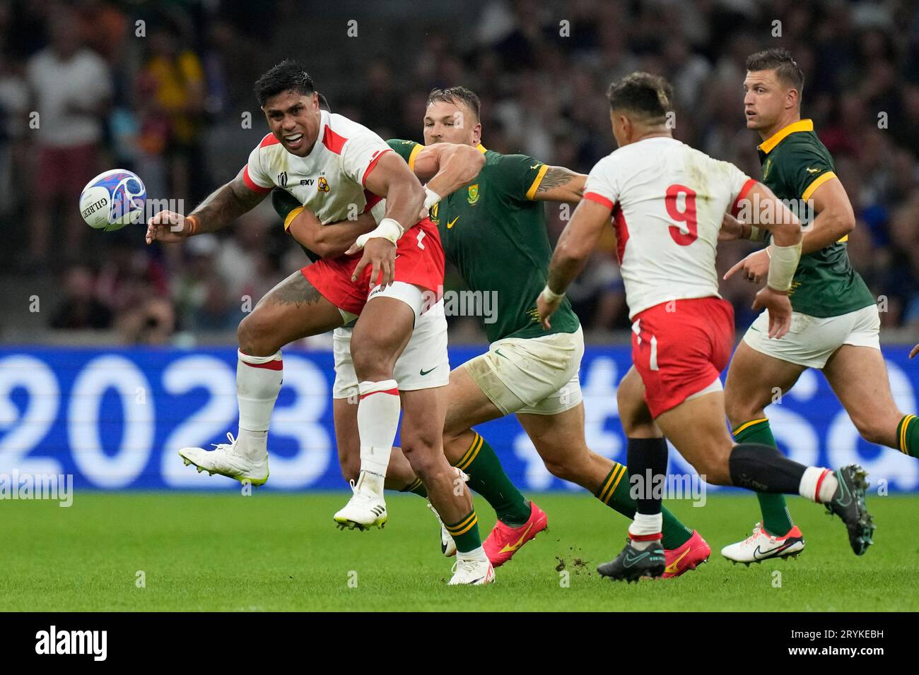 Tonga's Malakai Fekitoa, left, fails to reach the ball during the Rugby ...