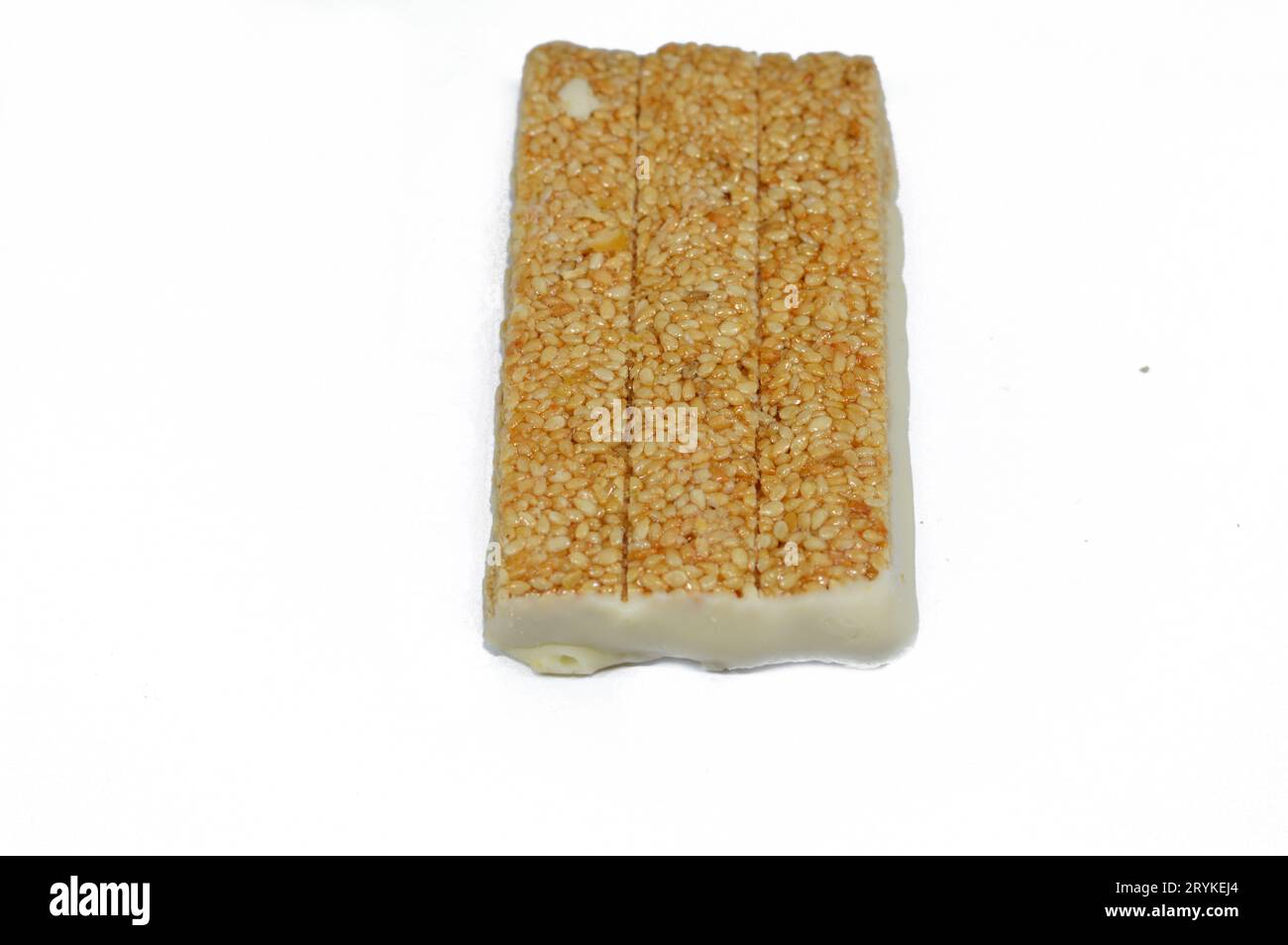 Sesame candy bars sweets with wafer and white chocolate layer, an ...