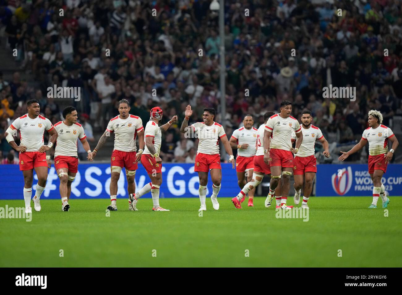 Tonga players celebrate after Fine Inisi scores their side's second try ...