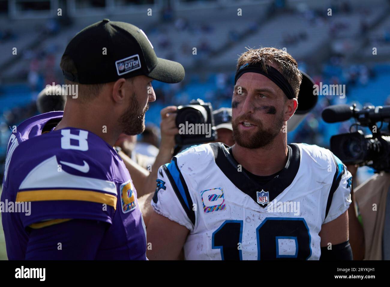 Carolina Panthers wide receiver Adam Thielen (19) chats with former ...