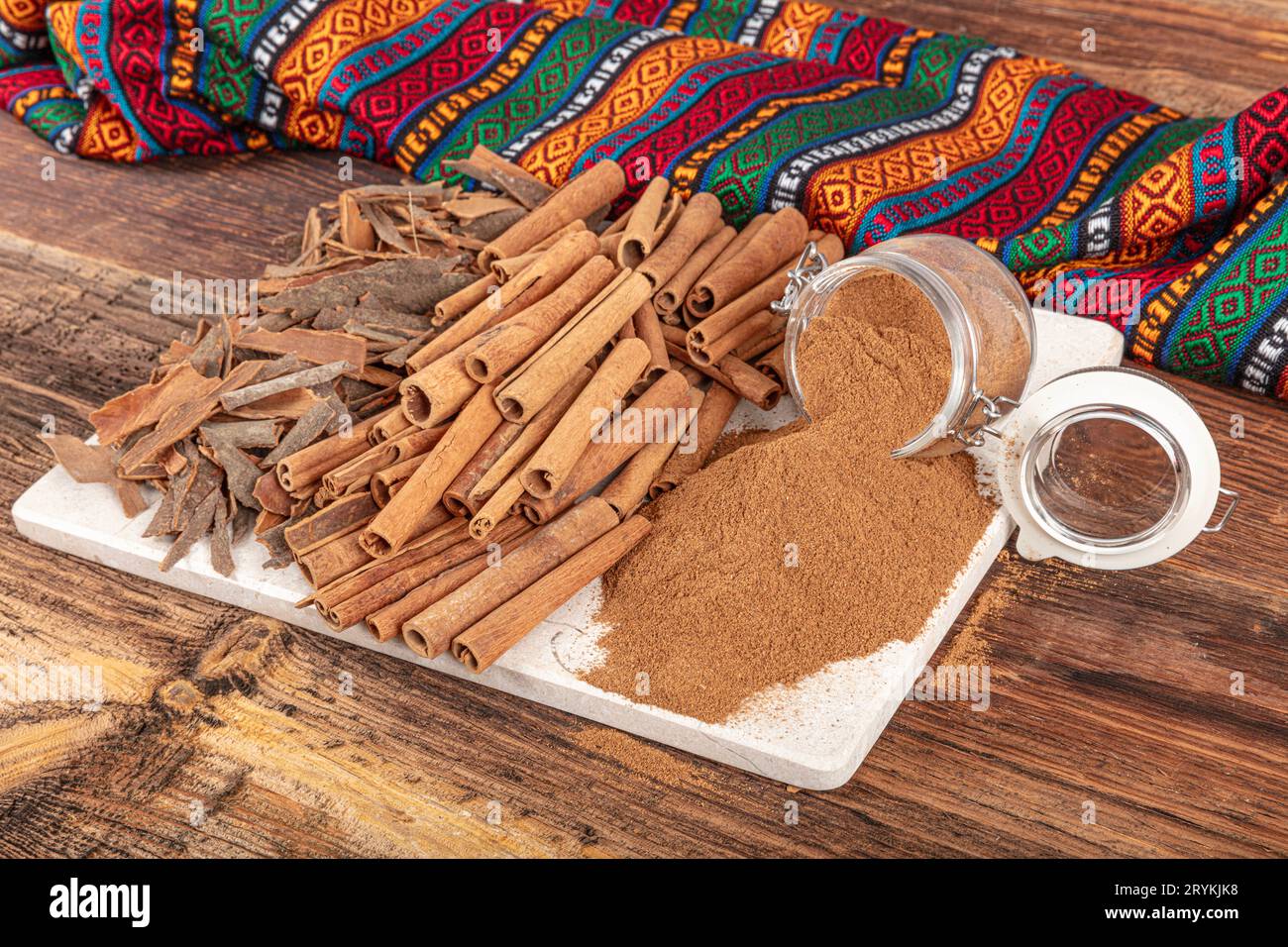 Cinnamon sticks on a wooden background. Cinnamon spice in a spoon and ...