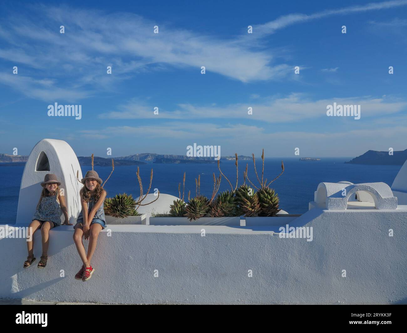 Little girls on the streets of Santorini island, Greece Stock Photo - Alamy