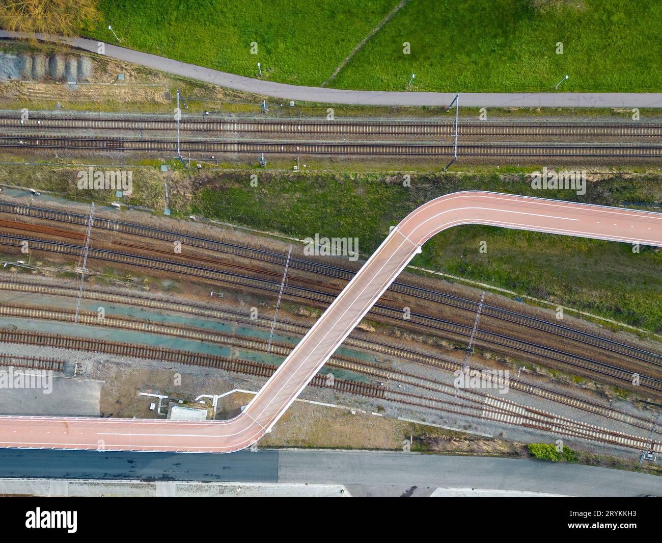 Aerial view shot by a drone of a cyclists and pedestrian bridge over ...