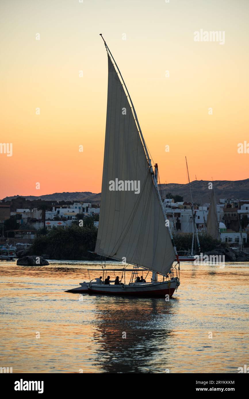 Felucca at dusk on Nile river in Aswan - Egypt Stock Photo - Alamy