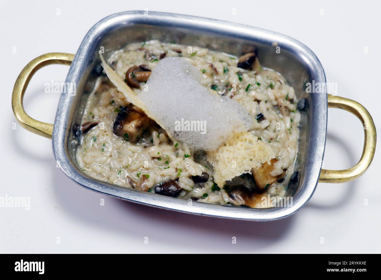 italian food wild mushroom risotto in a copper pan Stock Photo - Alamy