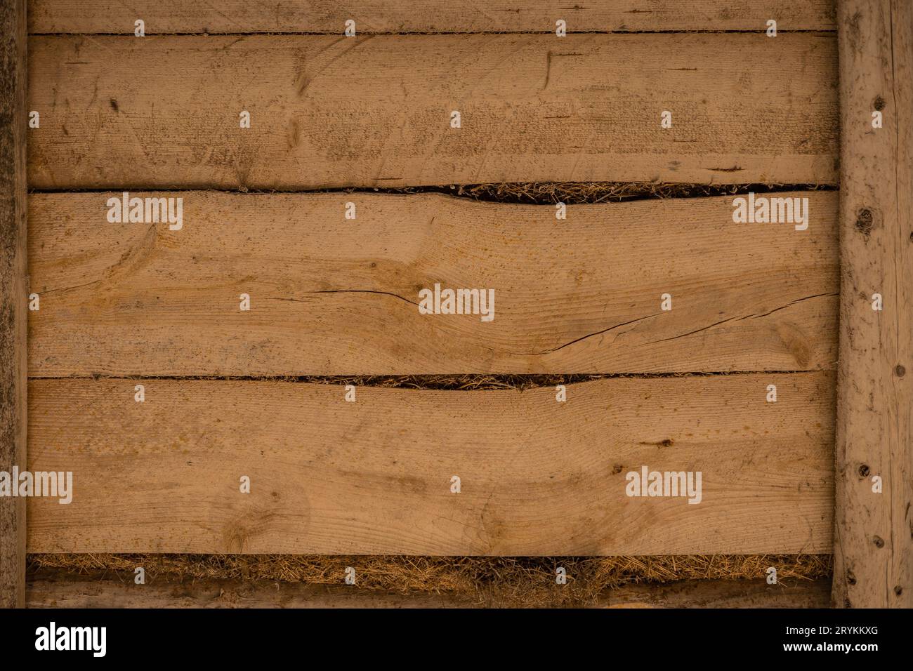Vertical view of wooden boards used as a floor of a hay rack or storage ...