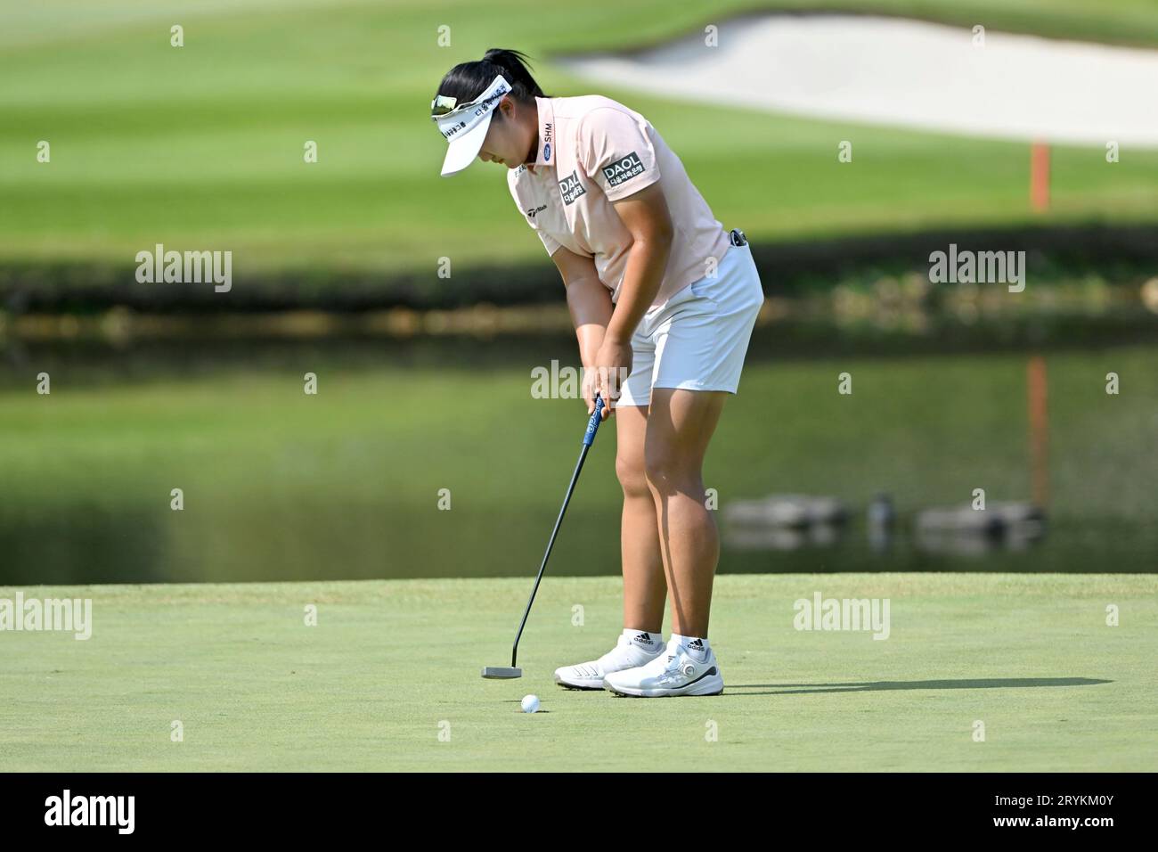 Hae Ran Ryu makes her putt on the second green during the final round ...