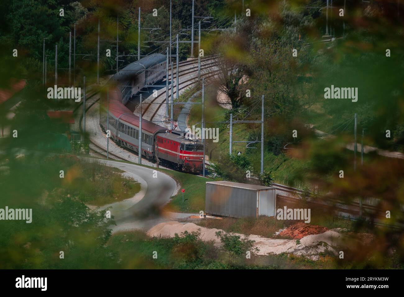 Classical passenger train with rail cars is rushing past the Rimske ...