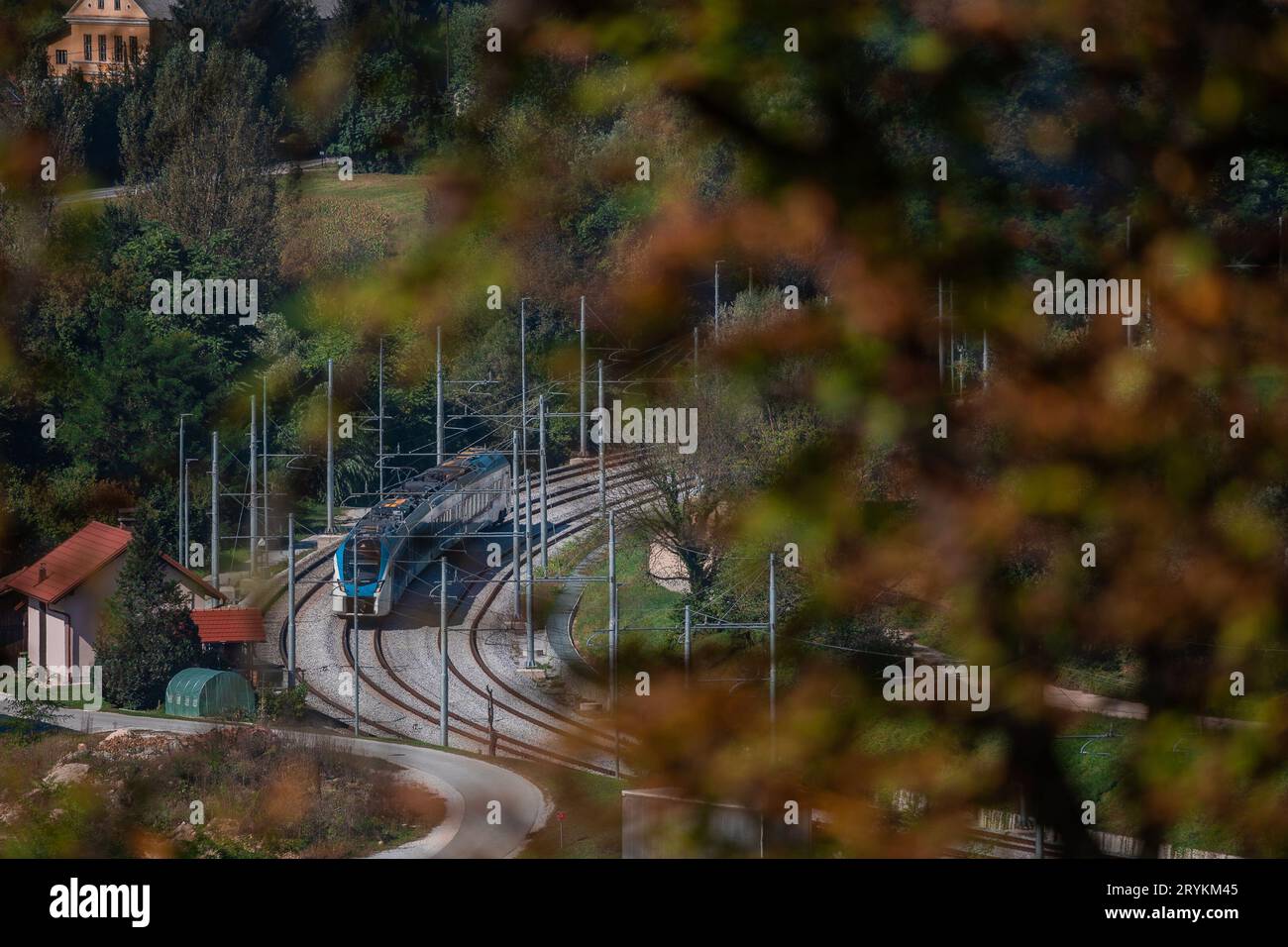 Modern passenger EMU train with rail cars is rushing past the Rimske ...