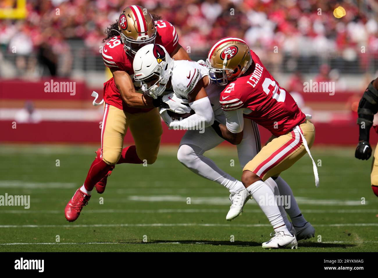 Arizona Cardinals wide receiver Michael Wilson, middle, runs against ...