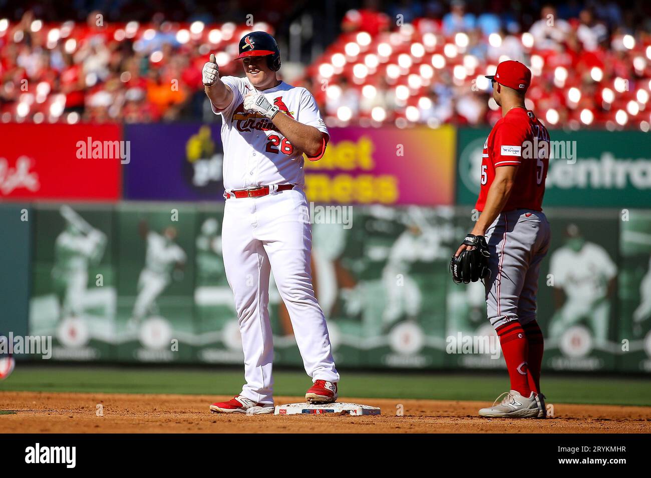 St. Louis Cardinals' Luken Baker, left, gestures toward the dugout ...