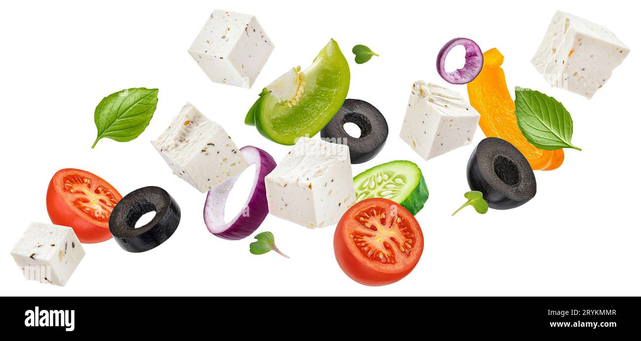 Falling greek salad isolated on white background Stock Photo - Alamy
