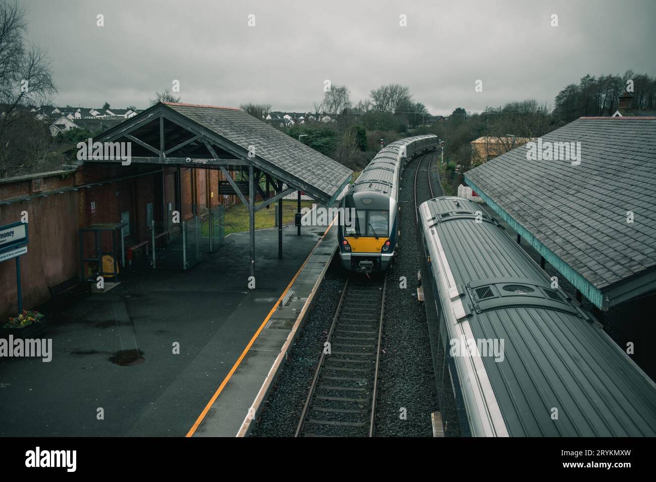 Two diesel trains are crossing at ballymoney train station in northern ...