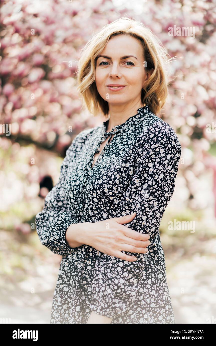 Portrait of an adult contented woman in her forties. The woman enjoys ...