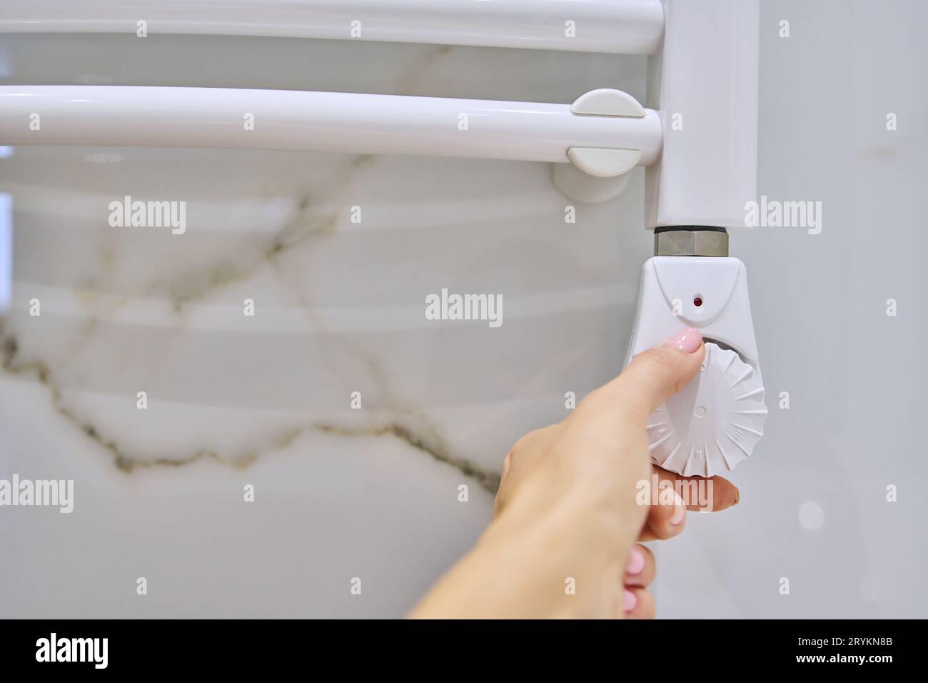 Electric wall-mounted heating radiator, hand on temperature thermostat ...