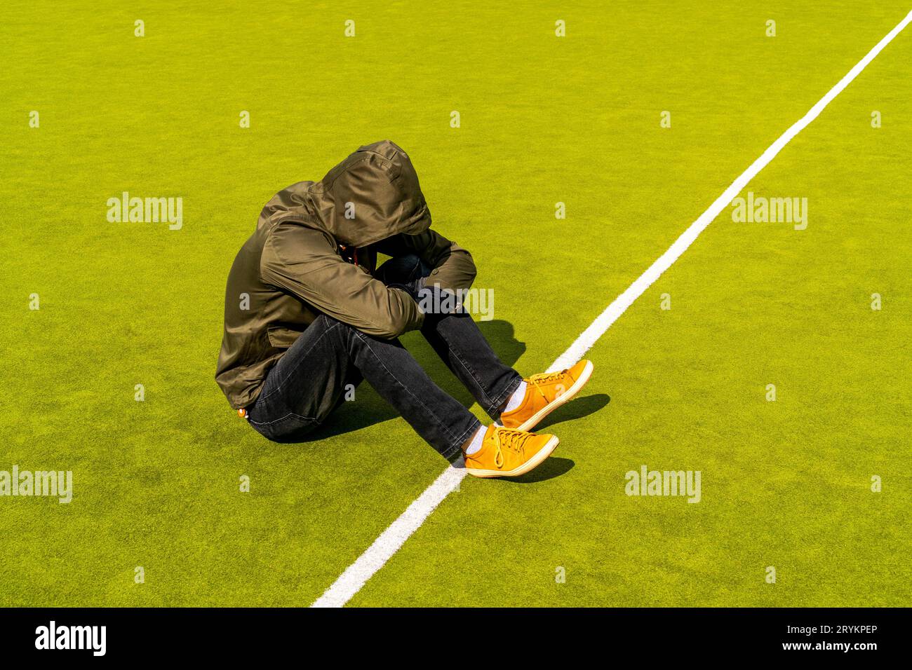 Depressed and hopeless man sitting alone after using drugs and drunk ...