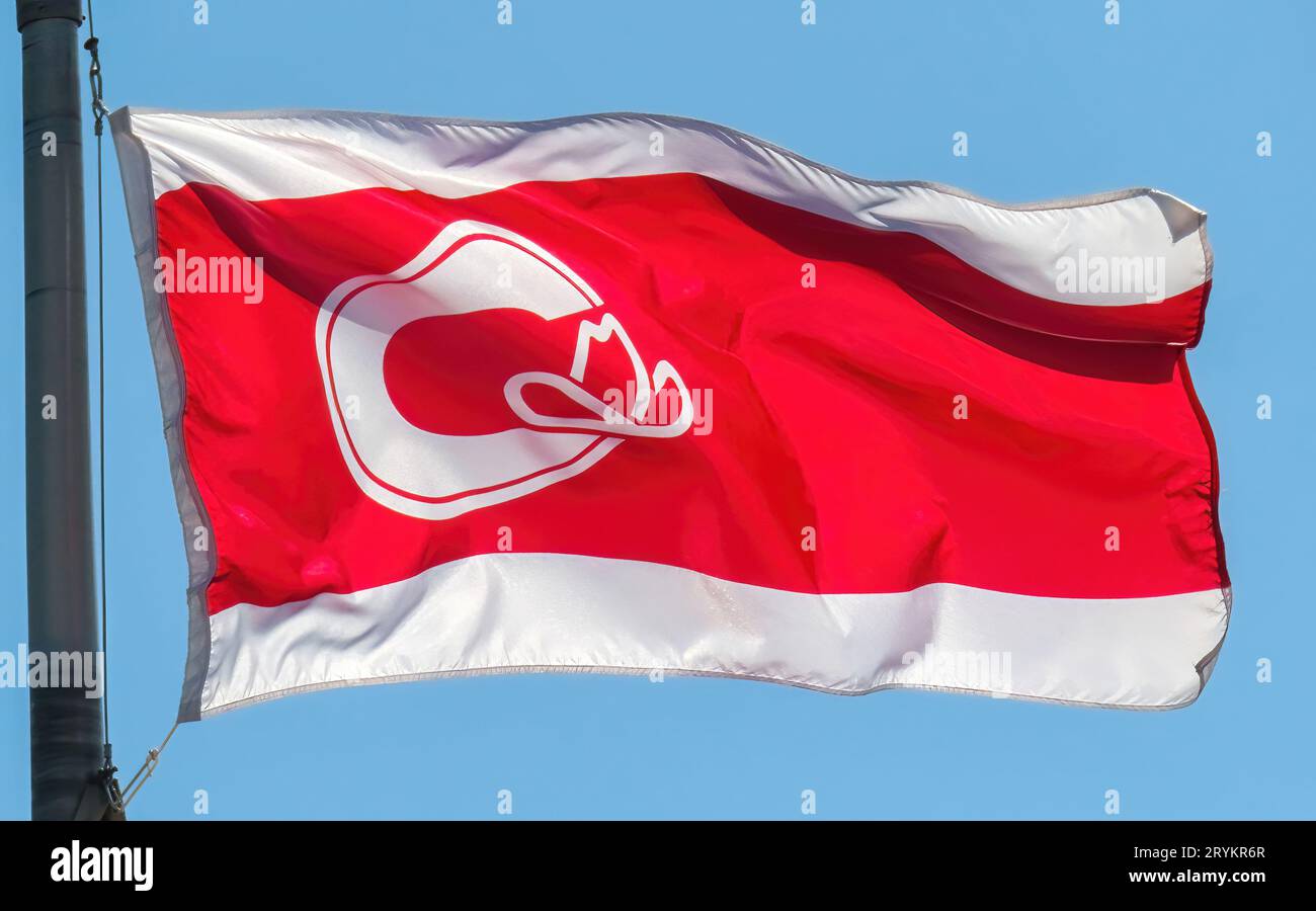 Close up to the flag of Calgary that features a cowboy hat and the ...