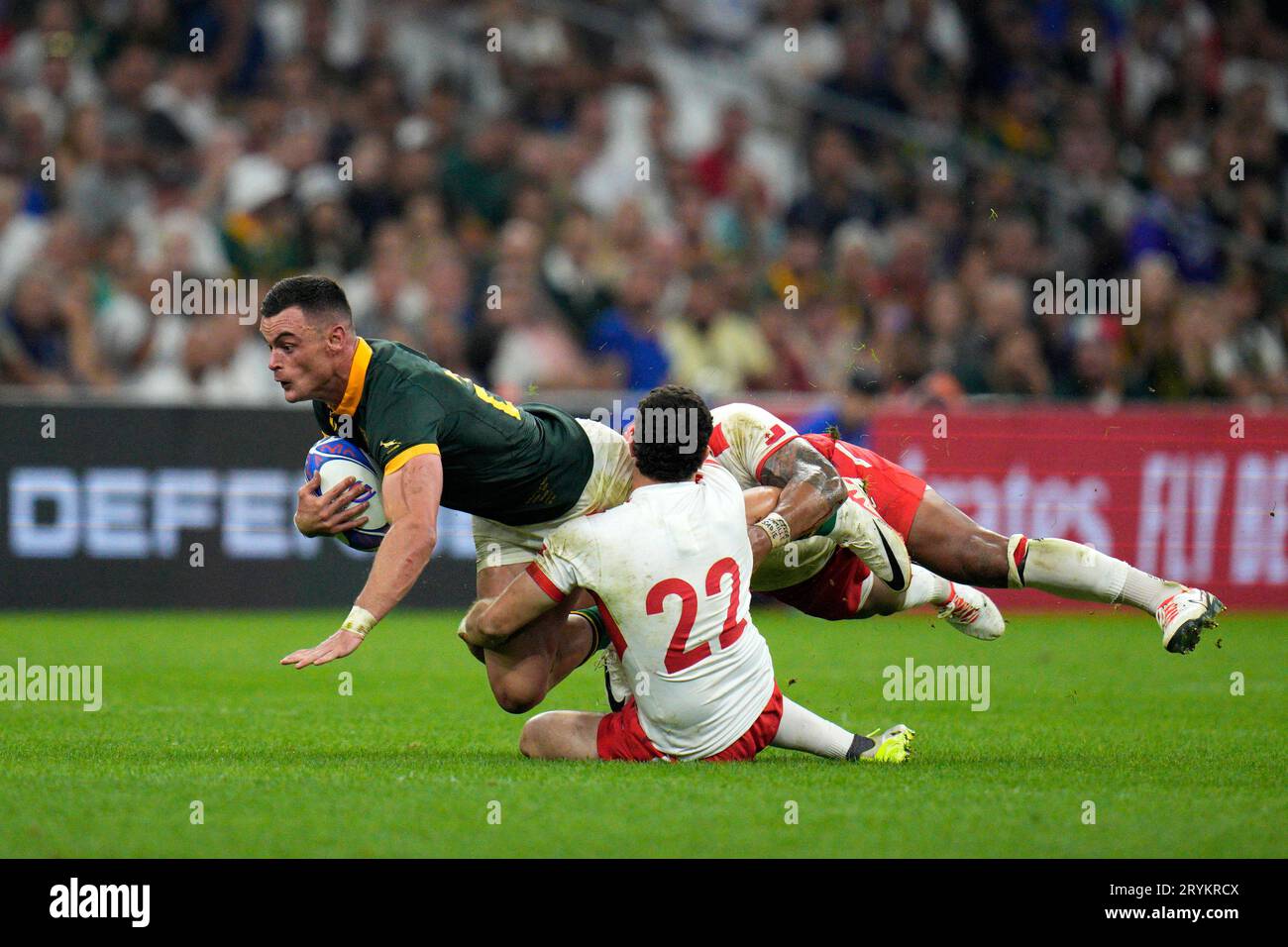 South Africa's Jesse Kriel, is tackled by Tonga's Pita Ahki, behind ...