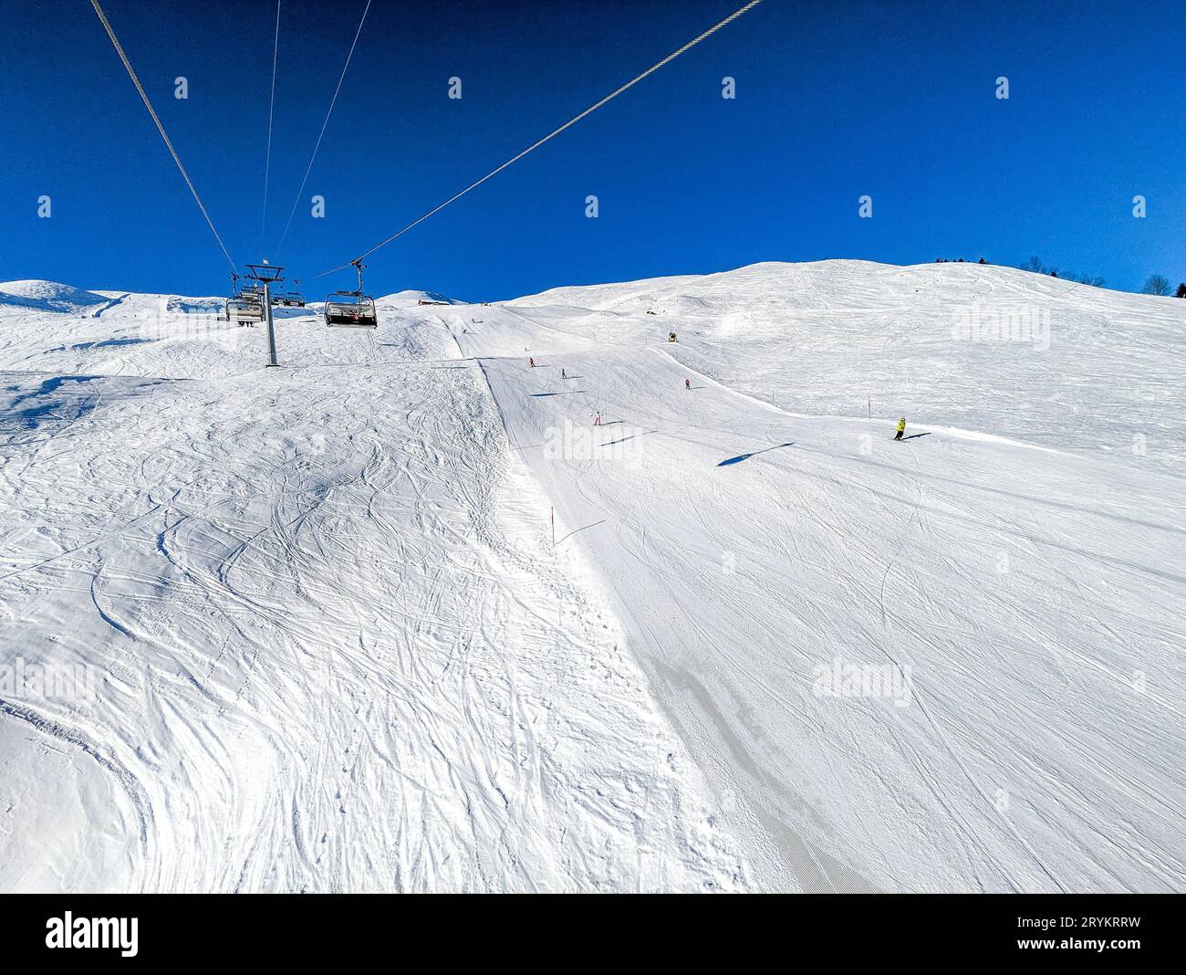 Aerial drone view of snow covered mountains and ski slopes, ski area ...