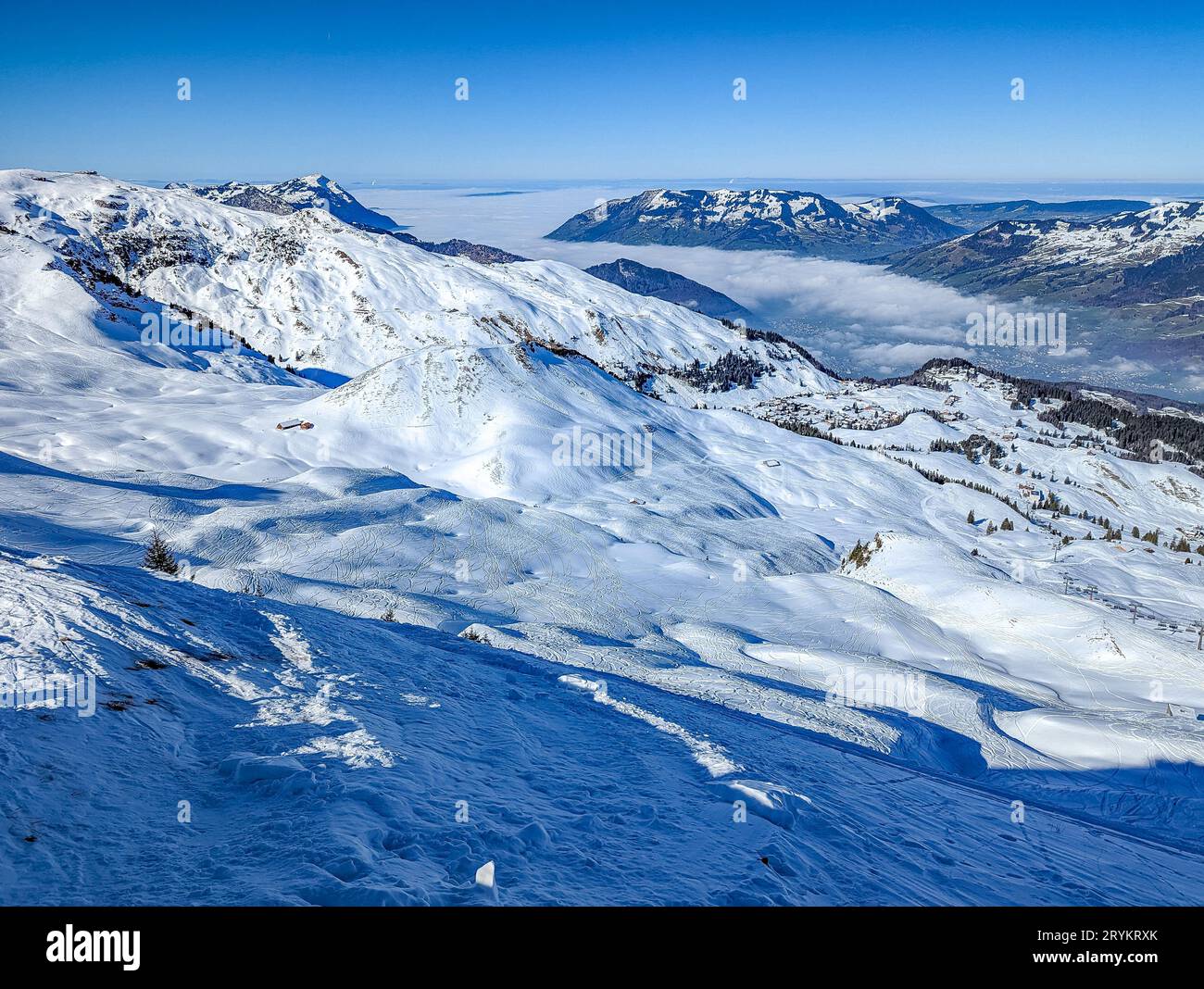 Aerial drone view of snow covered mountains and ski slopes, ski area ...
