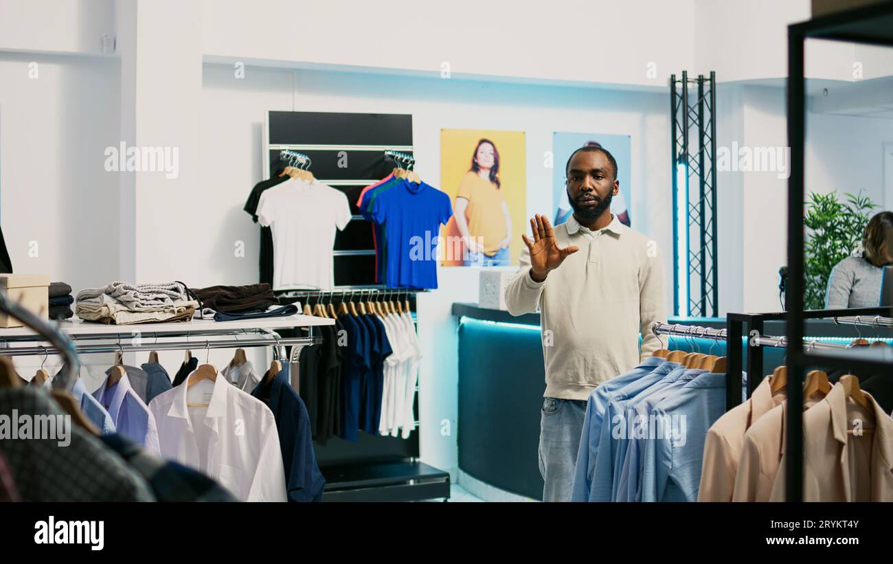 African american shopper using hologram in boutique to check new ...