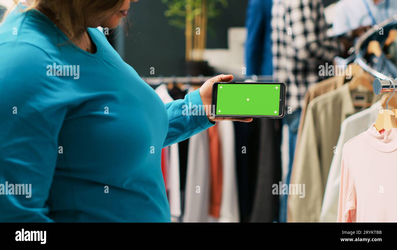 African american woman analyzing phone with greenscreen template ...