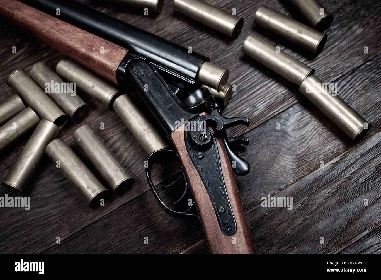 Antique 12-gauge break-action smooth-bored shotgun with yellow brass ...