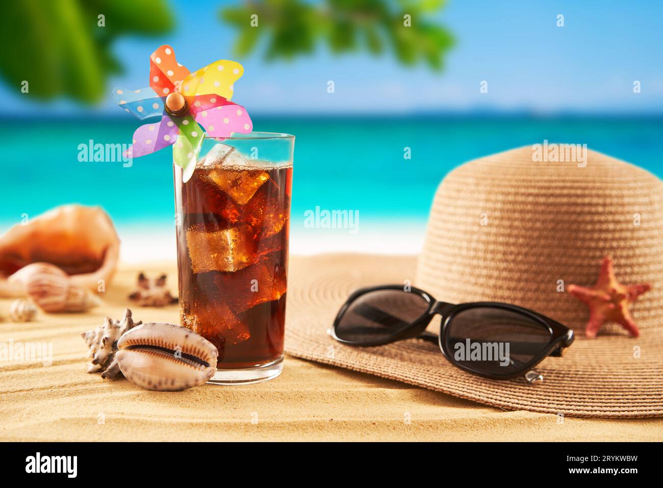 Straw hat, sunglasses and cocktail on the sand and sea background. Relax on the beach Stock ...