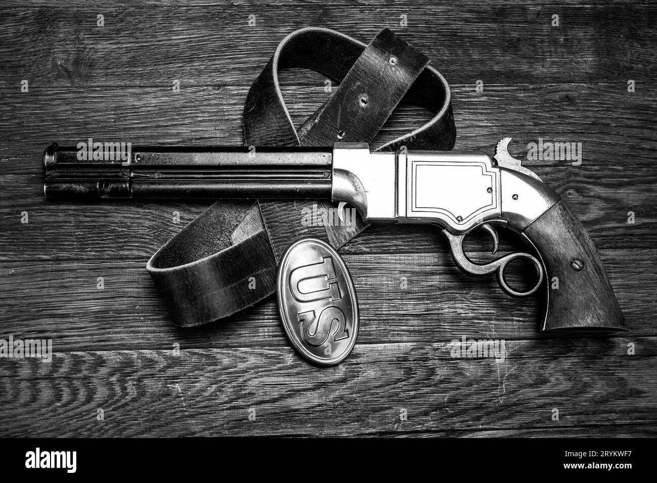 Vintage gun - Volcanic Repeating Pistol on wooden table with US Buckle ...