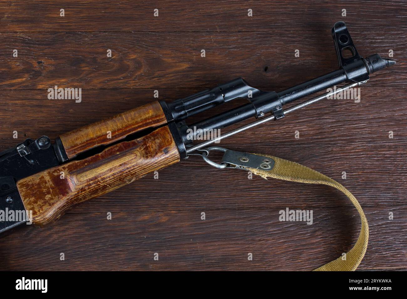 Kalashnikov ak 47 gun on wooden table background Stock Photo - Alamy