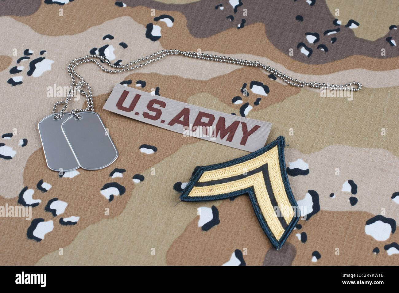 US ARMY branch tape and corporal rank patch with dog tags on desert ...