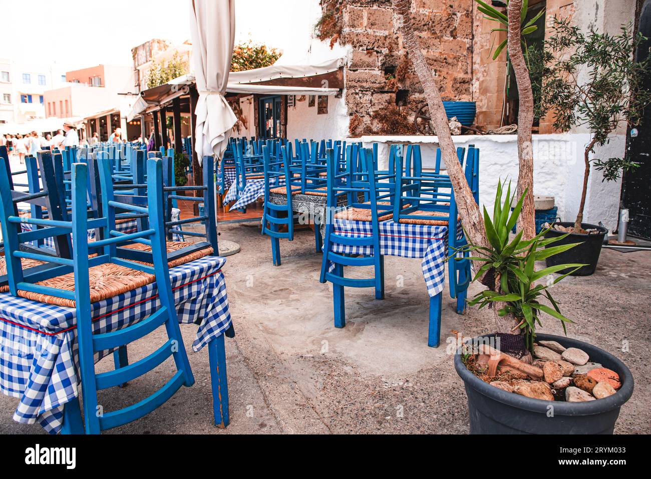Typical greek blue tables and chairs in a restaurant Stock Photo - Alamy