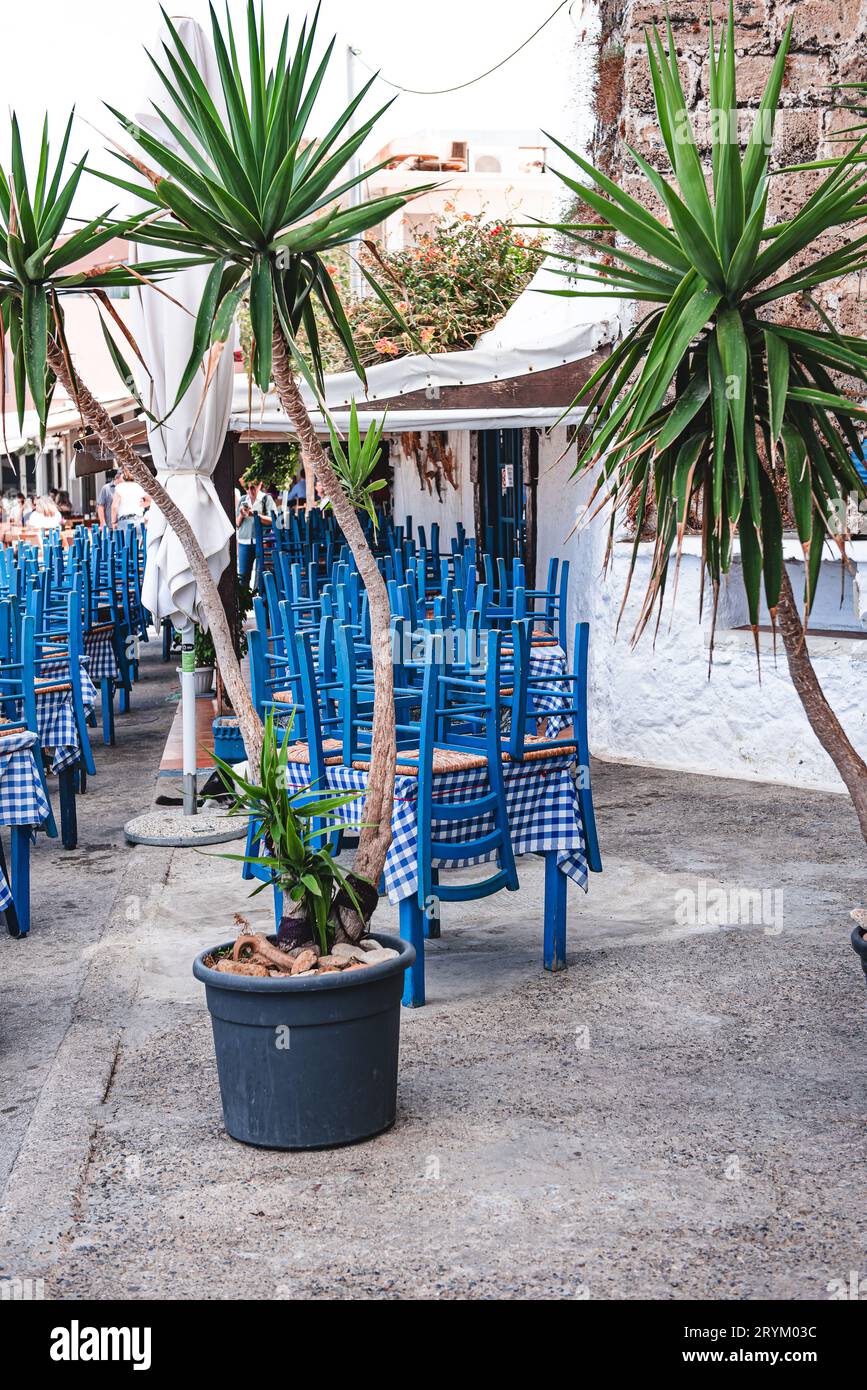 Typical greek blue tables and chairs in a restaurant Stock Photo - Alamy