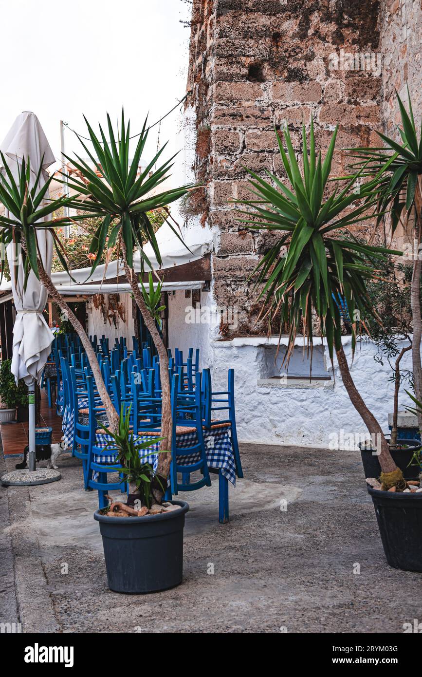Typical greek blue tables and chairs in a restaurant Stock Photo - Alamy