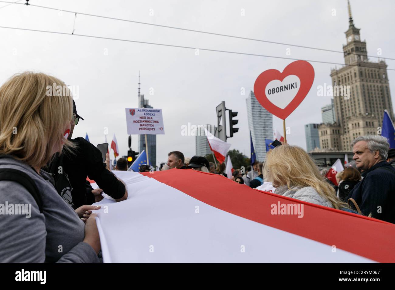 People Are Holding The Polish Flag In The Center Of Warsaw Before The