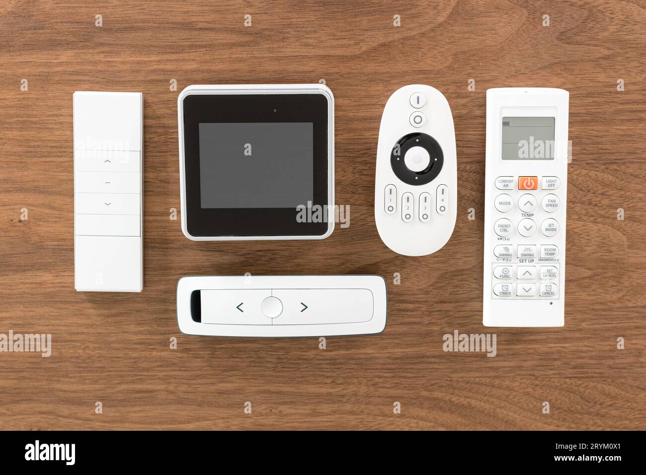 Variety of remote controls to control different appliances in a house ...