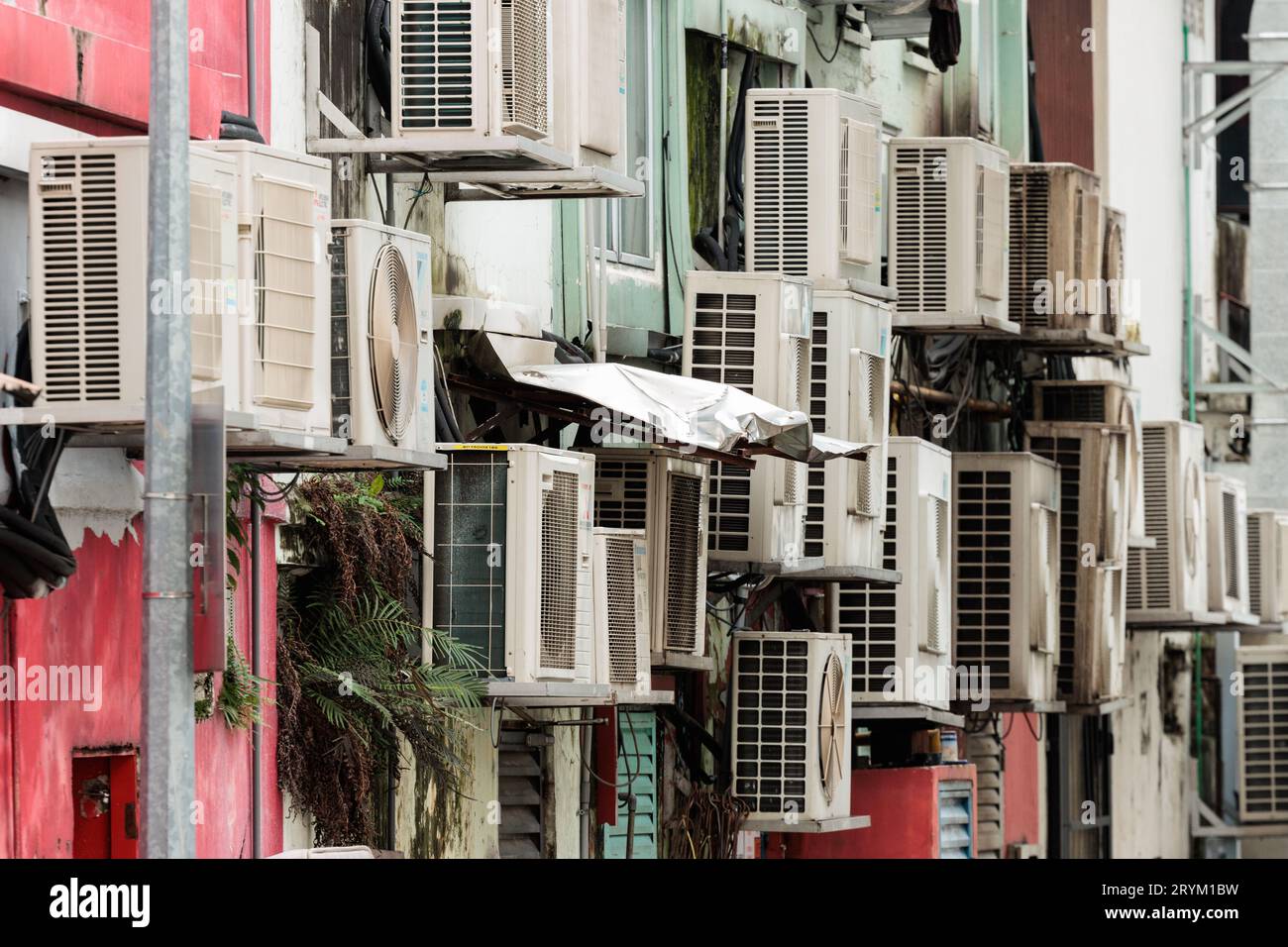 Multiple air-conditioning units stacked in a street of Singapore Stock ...