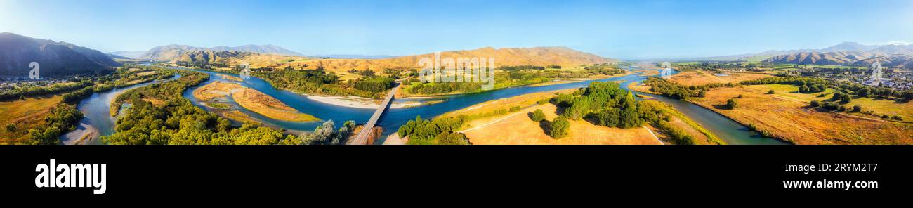 Wide aerial panorama of Waitaki river at Kurow town in New Zealand ...