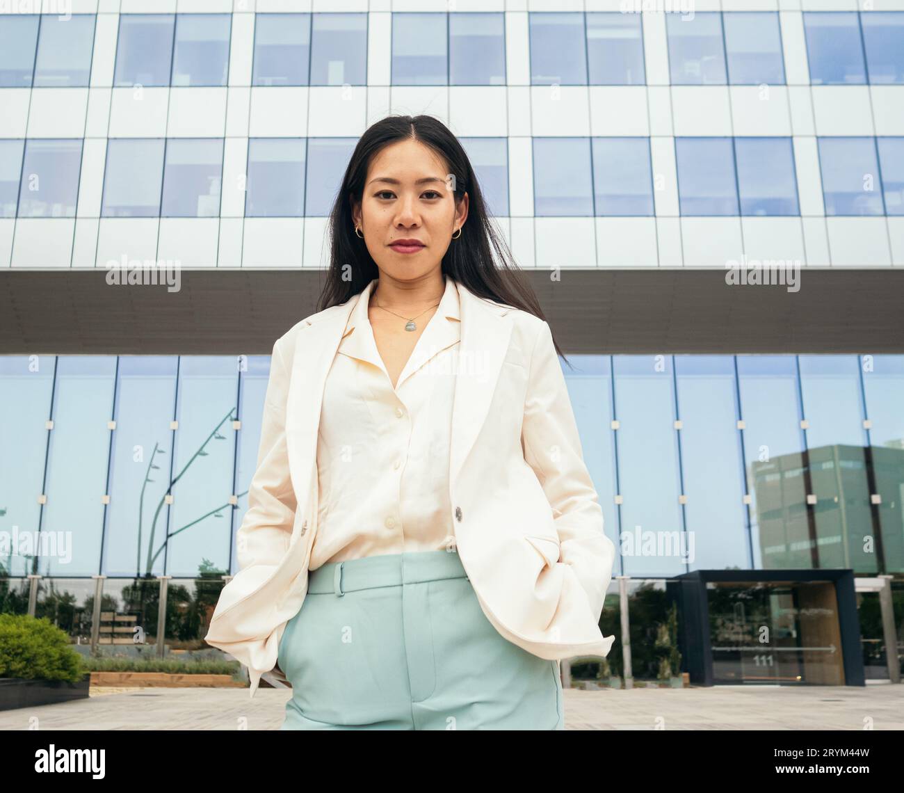 Asian business woman looking seriously at camera. Empowered female ...
