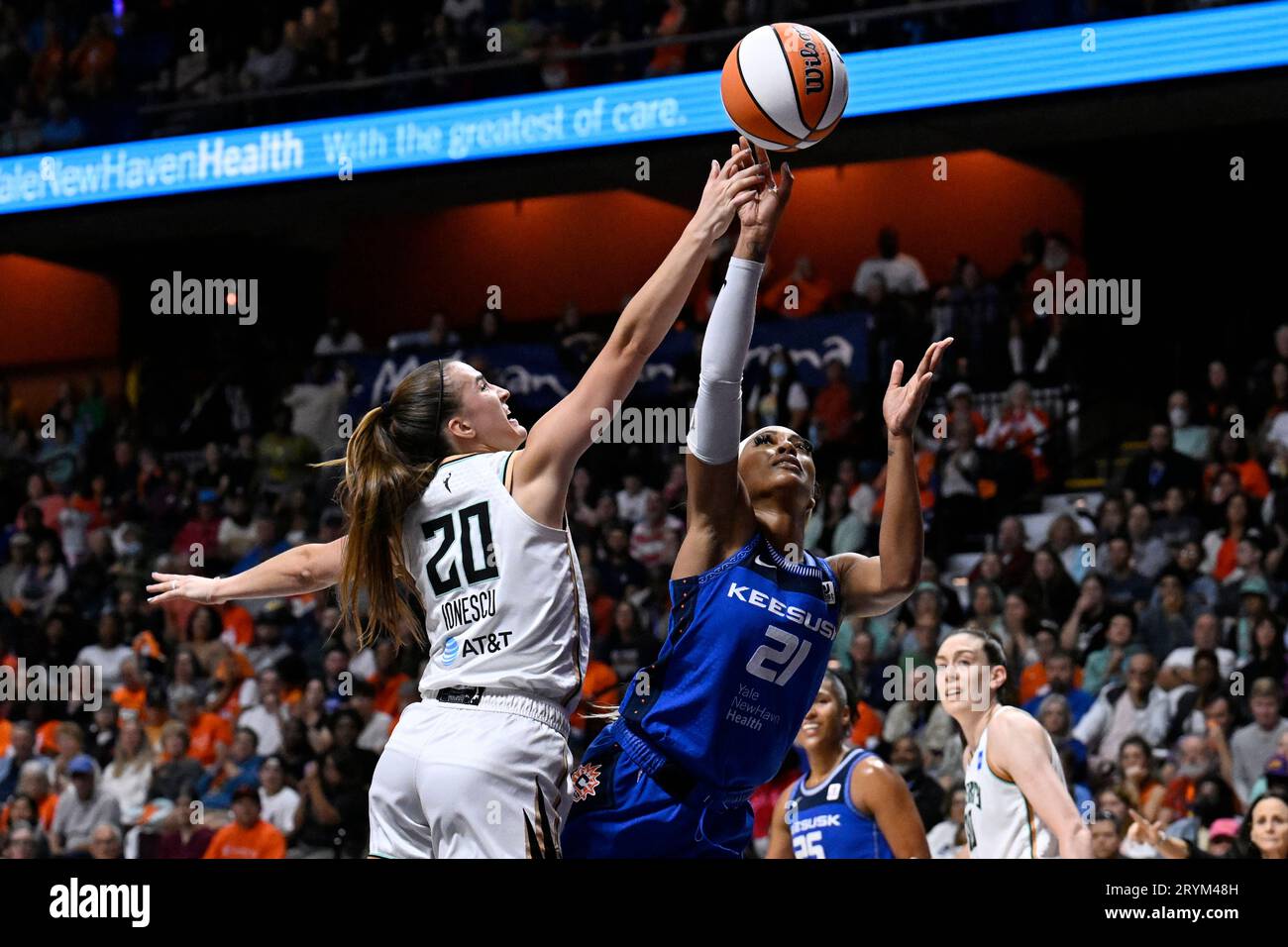 New York Liberty guard Sabrina Ionescu (20) fouls Connecticut Sun guard ...